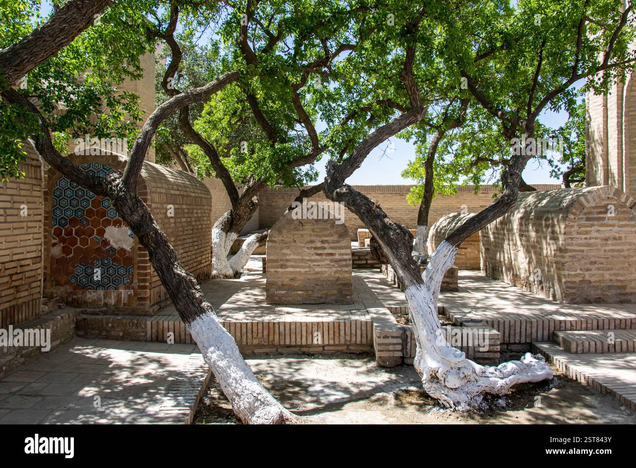 Historic Courtyard with Trees and Brick Structures Stock Photo - Alamy