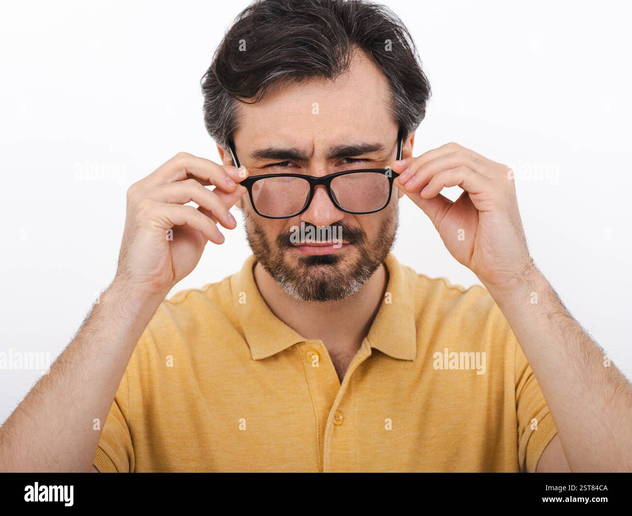 Man with poor eyesight uses prescription eyeglasses to correct his ...