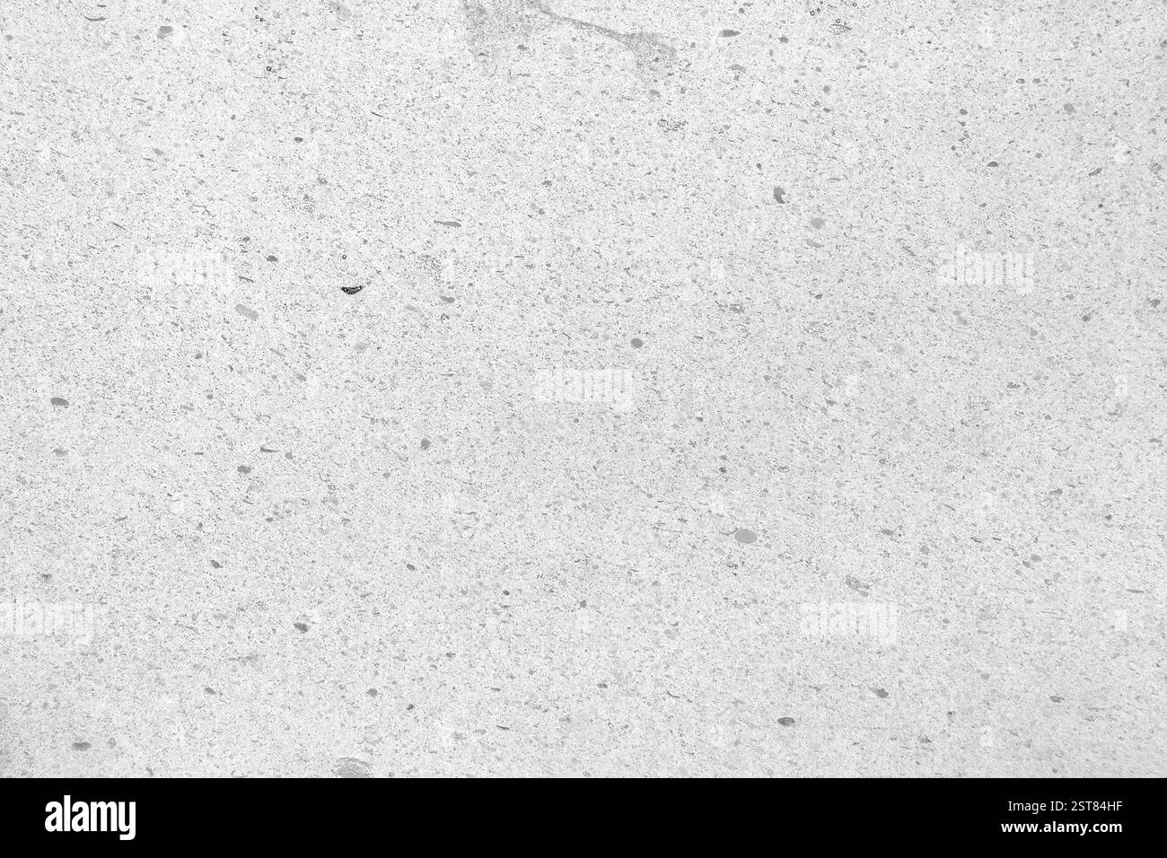 White concrete wall with grain texture and natural imperfections ...