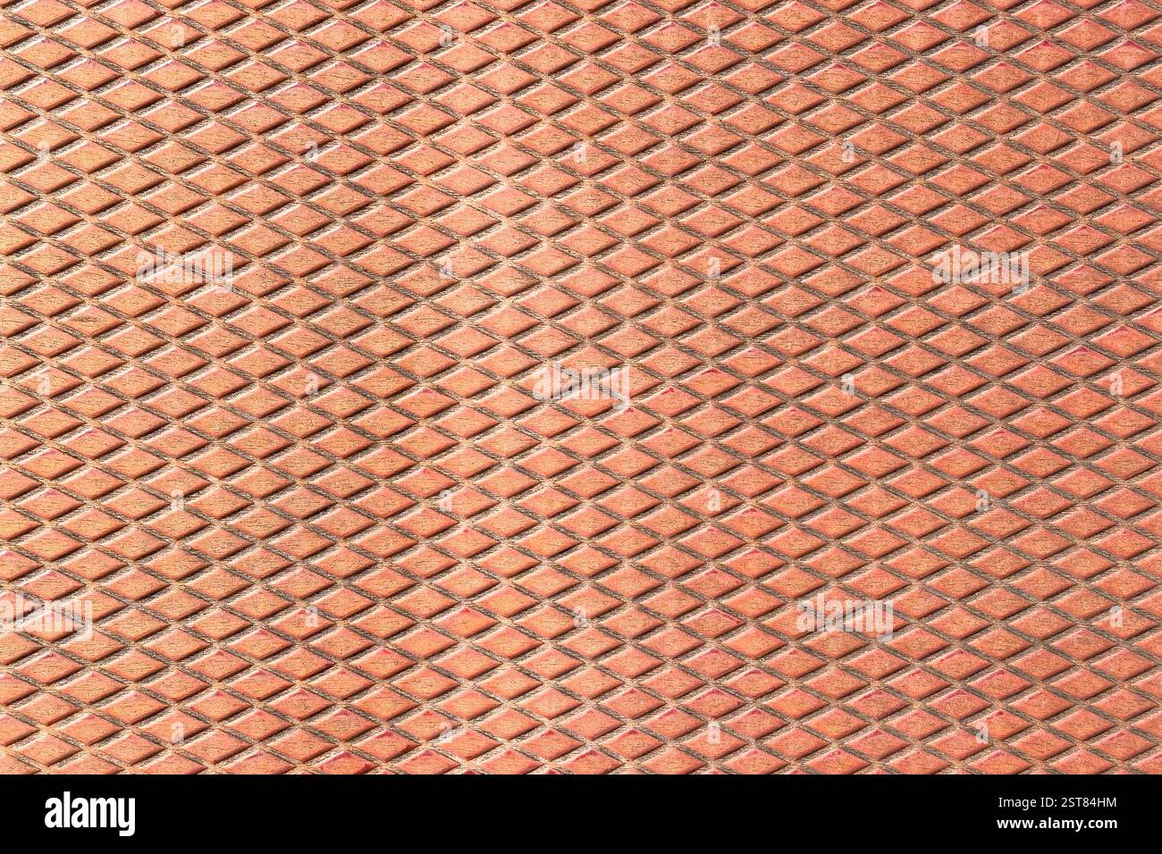 Rusty metal sheet with a repeating diamond pattern. Industrial building ...