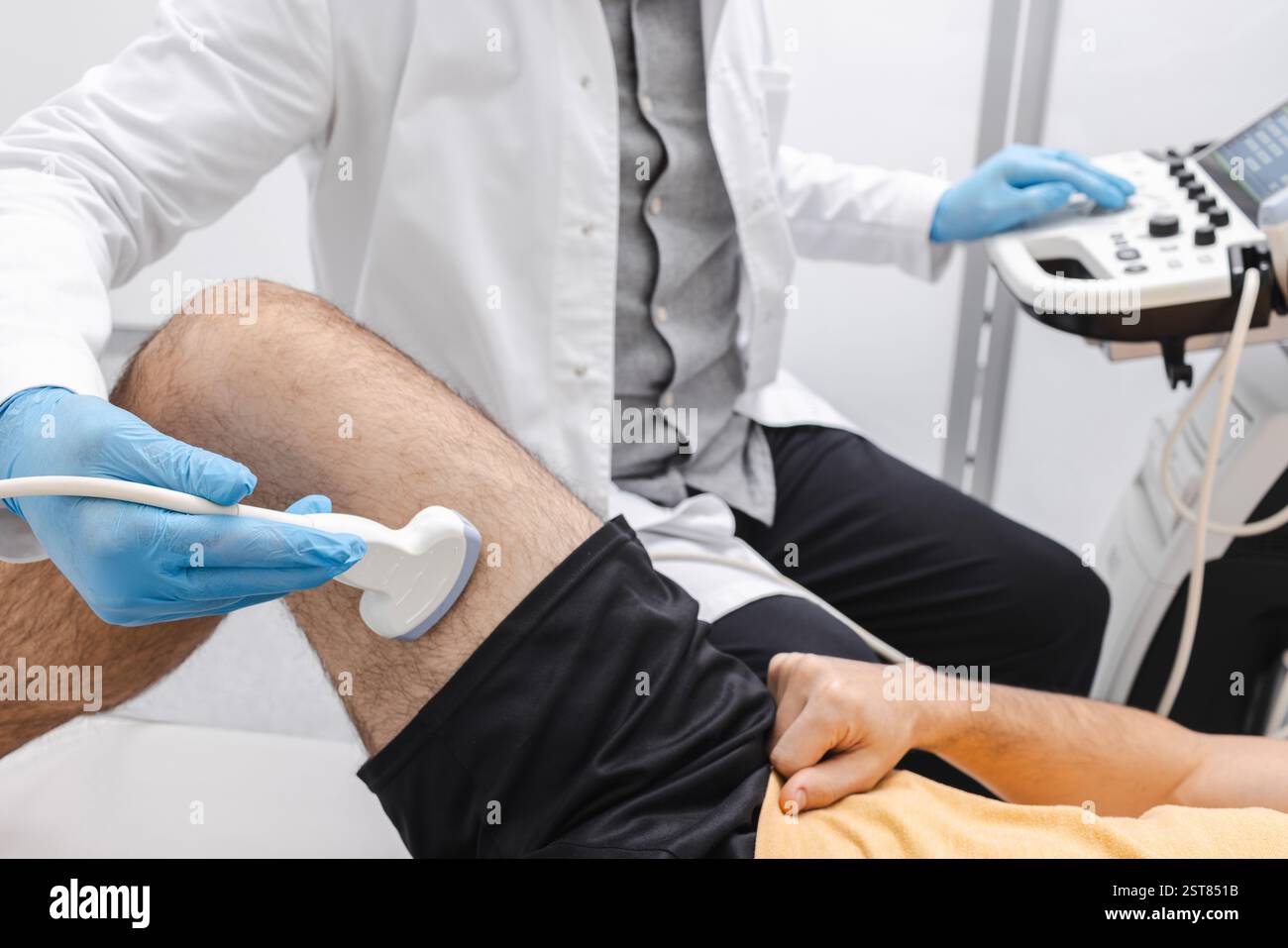 Leg venous ultrasound . Doctor sonographer examines veins condition of ...