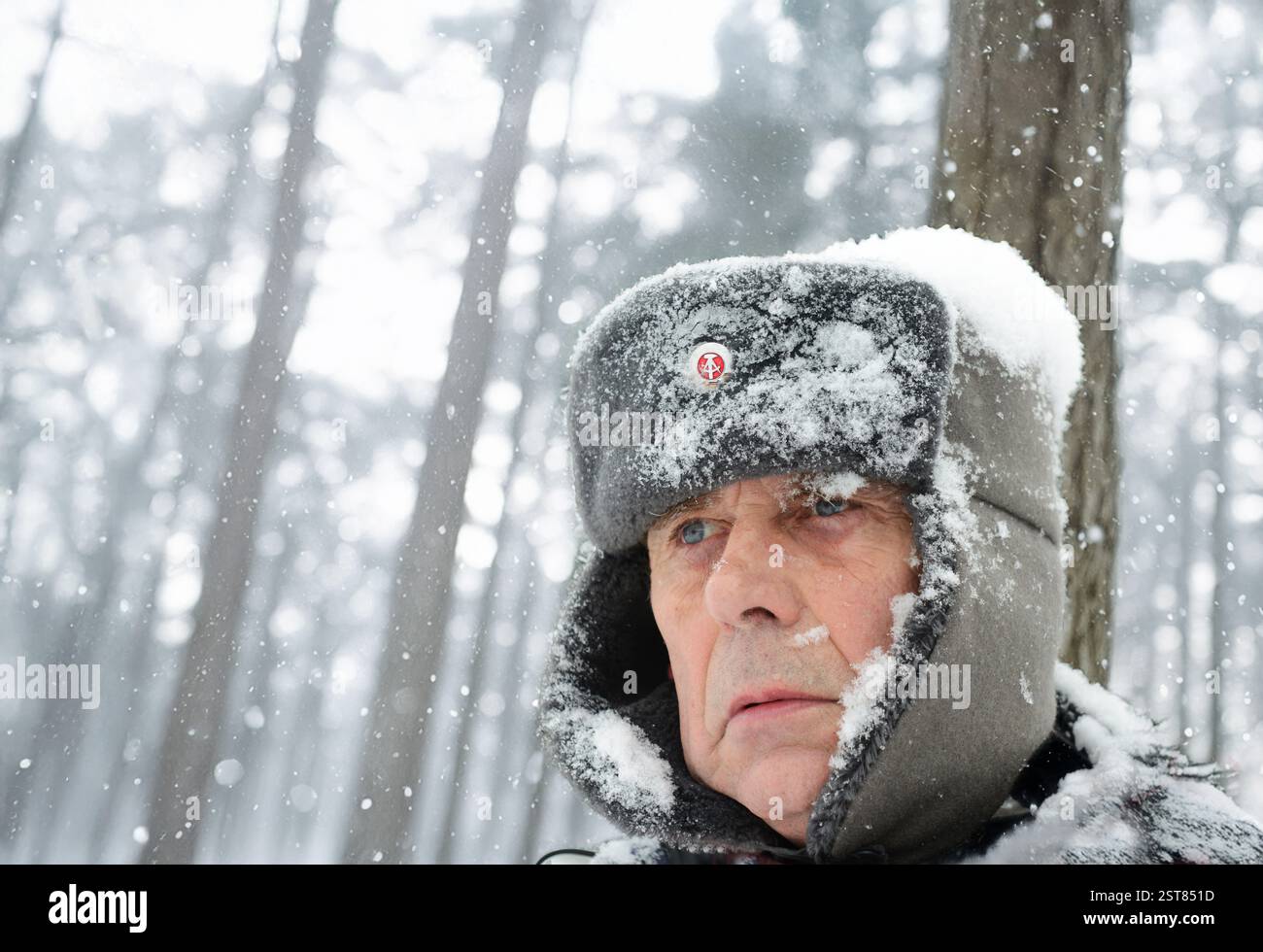 Man wearing East German border guard hat Stock Photo - Alamy