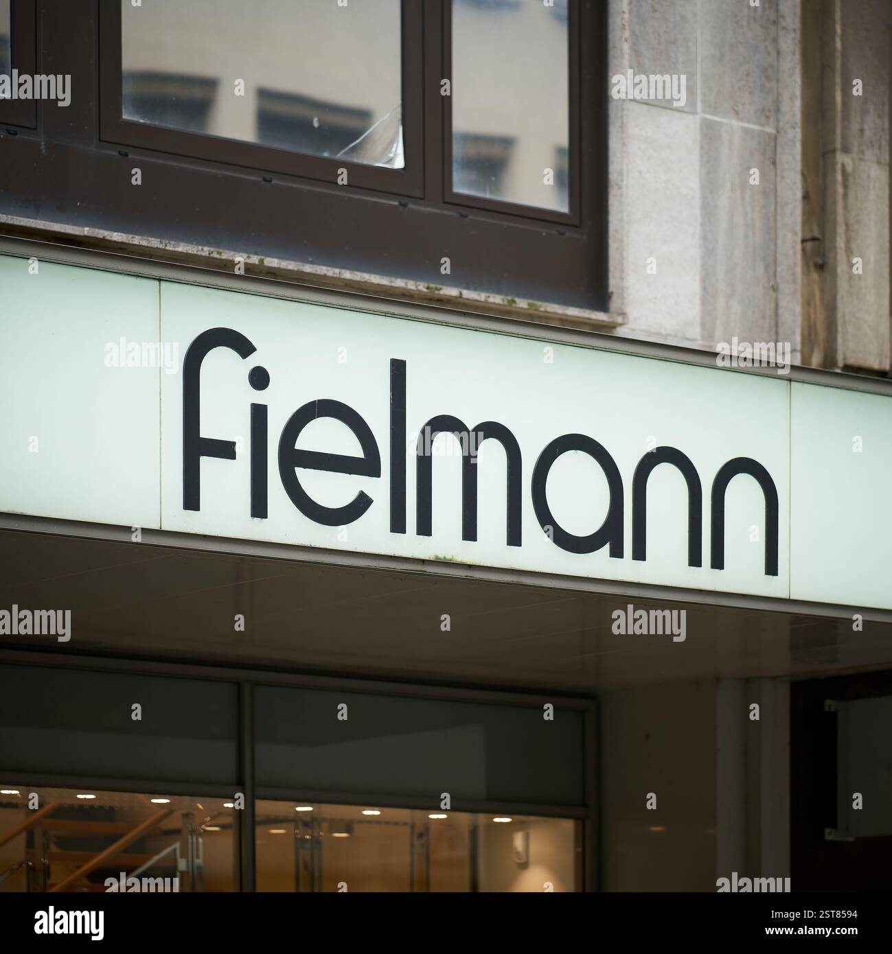 Lettering and logo of the German optician Fielmann in the city center ...