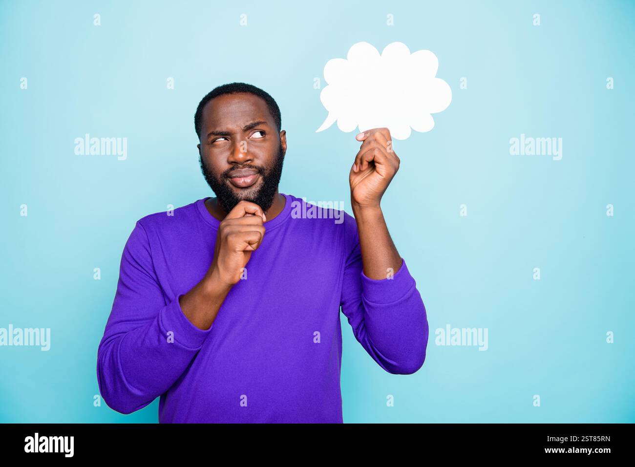 Photo of solving deciding man touching his beard in a fit of thoughts ...