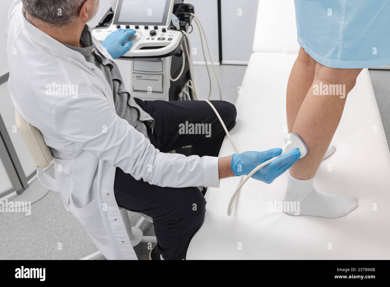 Leg venous ultrasound . Doctor sonographer examines veins condition of ...