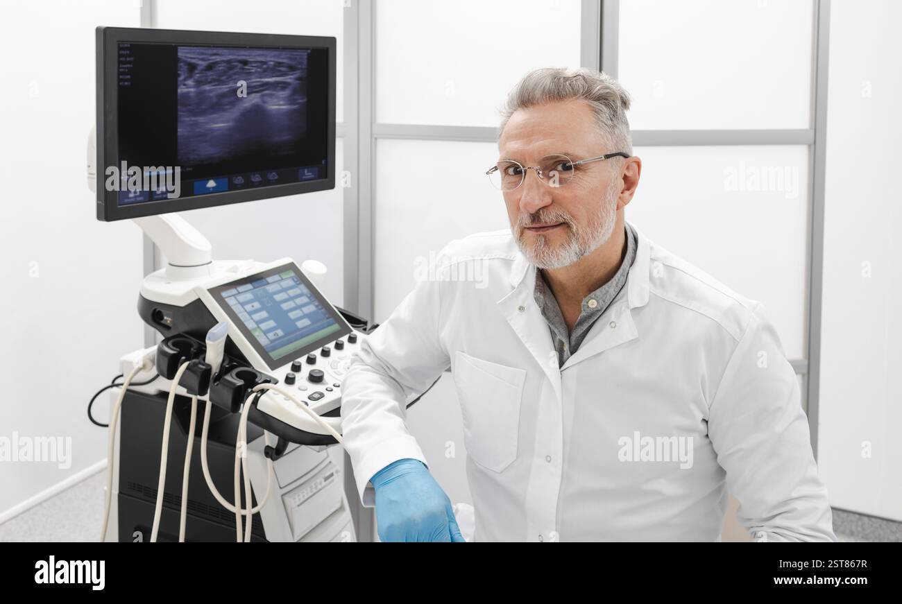 Ultrasound technician in modern medical clinic with diagnostic ...