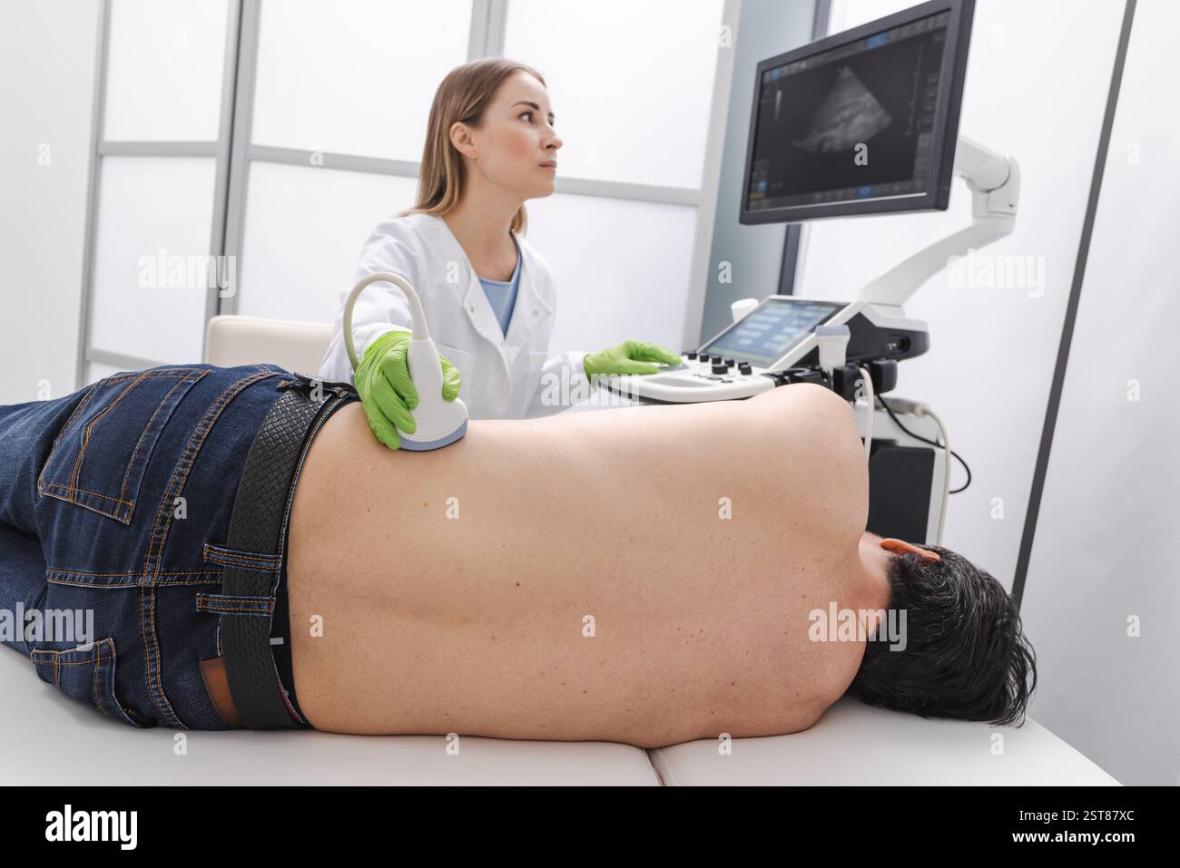 Ultrasound of kidneys. Man patient during ultrasound examination in ...