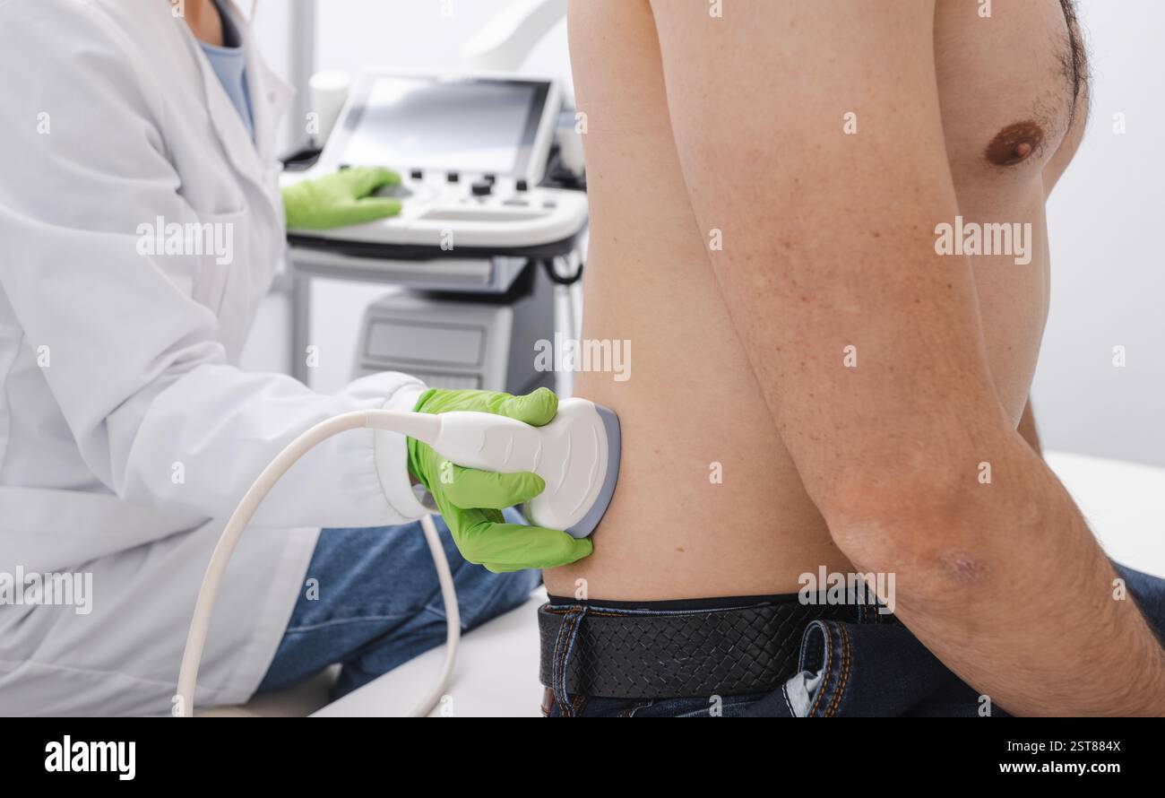 Close-up of ultrasound sensor of ultrasound machine in area of human ...