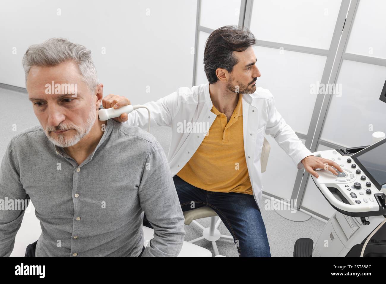 Vascular scientist using ultrasound scanning machine for examining ...