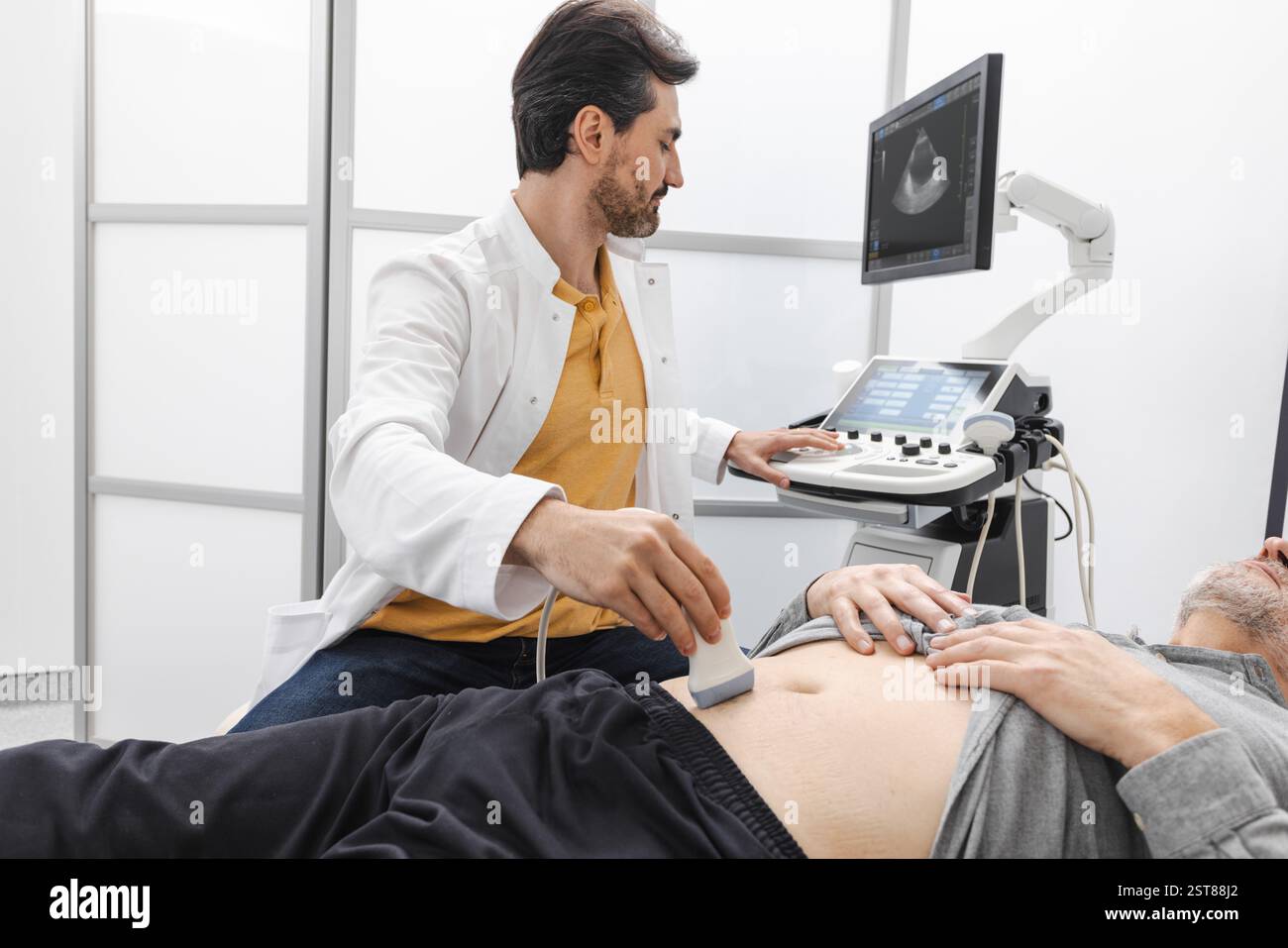 Ultrasound of prostate gland. Mature man getting ultrasound of prostate ... Ultrasound of prostate gland. Mature man getting ultrasound of prostate ...