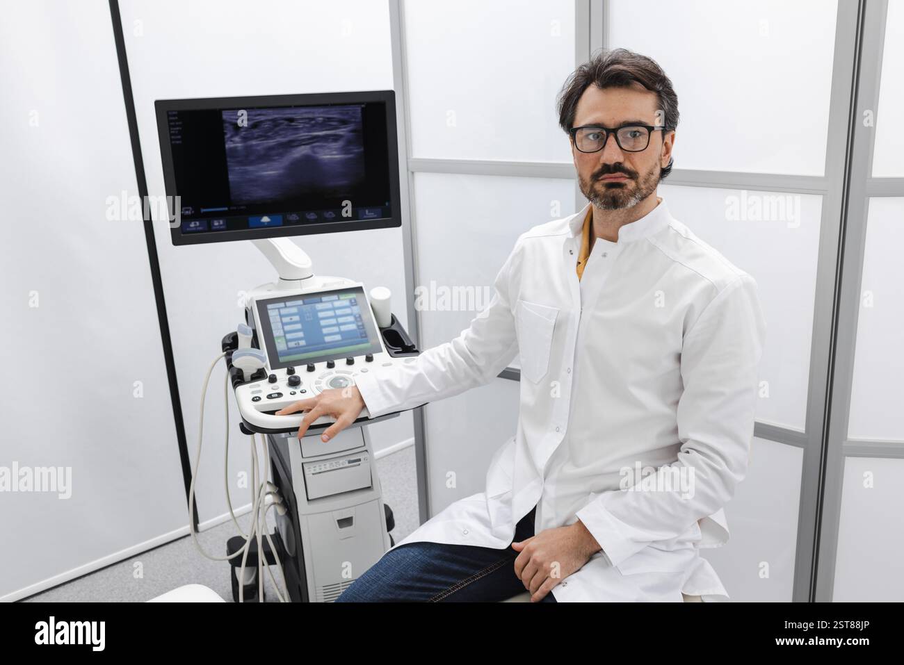 Ultrasound technician in modern medical clinic with diagnostic ...