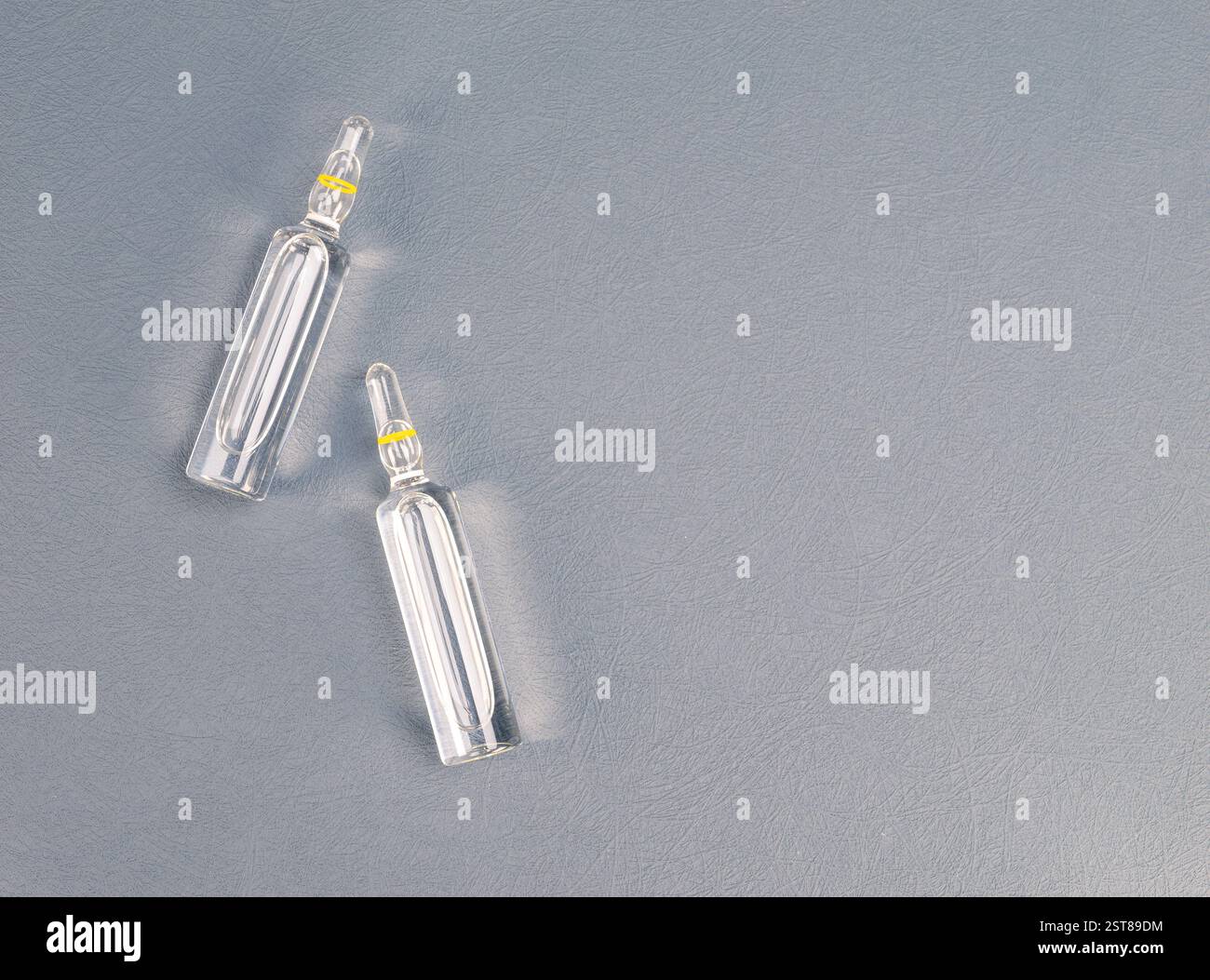 Ampoules with medicine on gray background. Pharmaceutical products ...