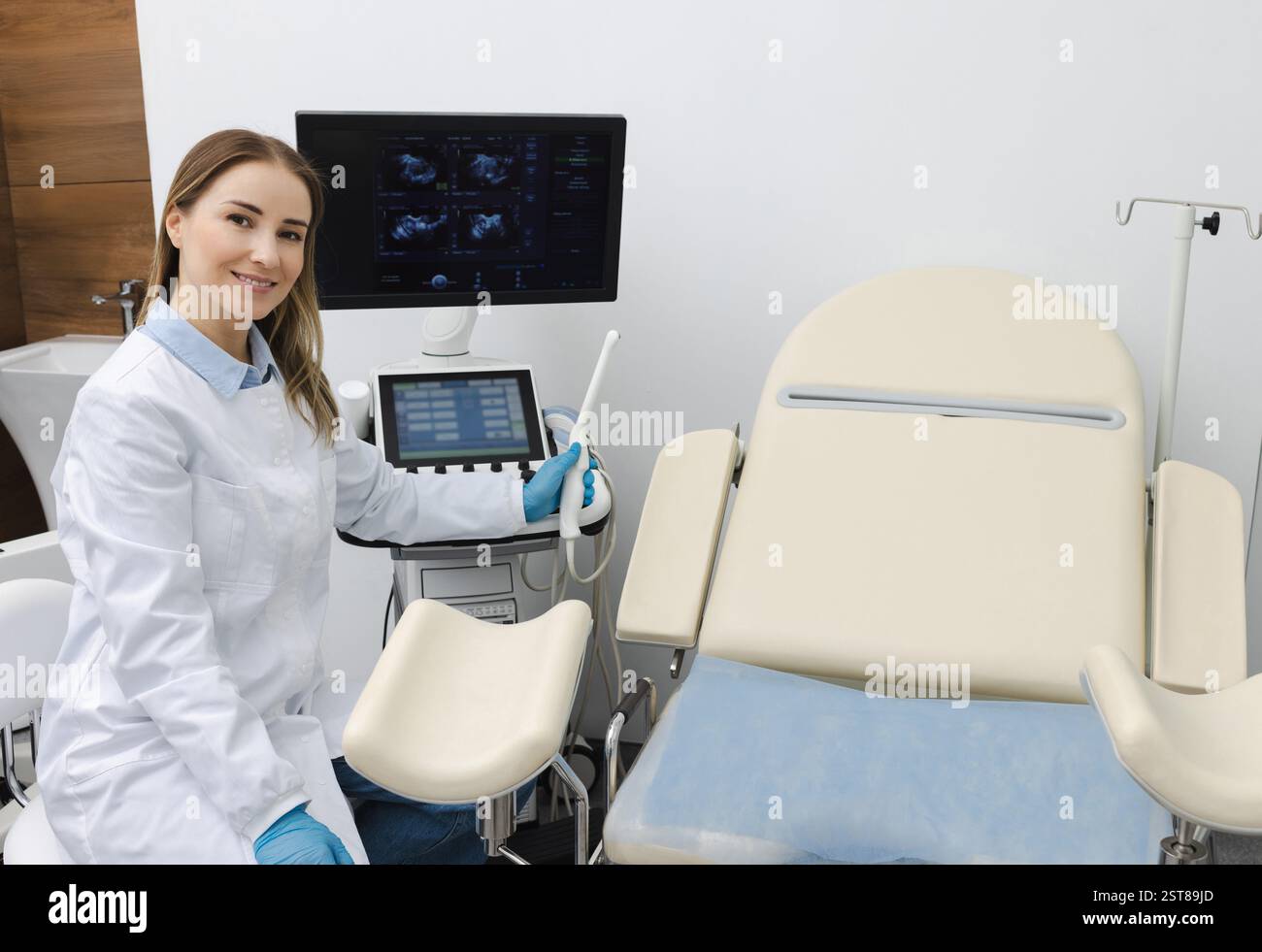 Portrait of smiling female gynecologist ultrasound technician with ...