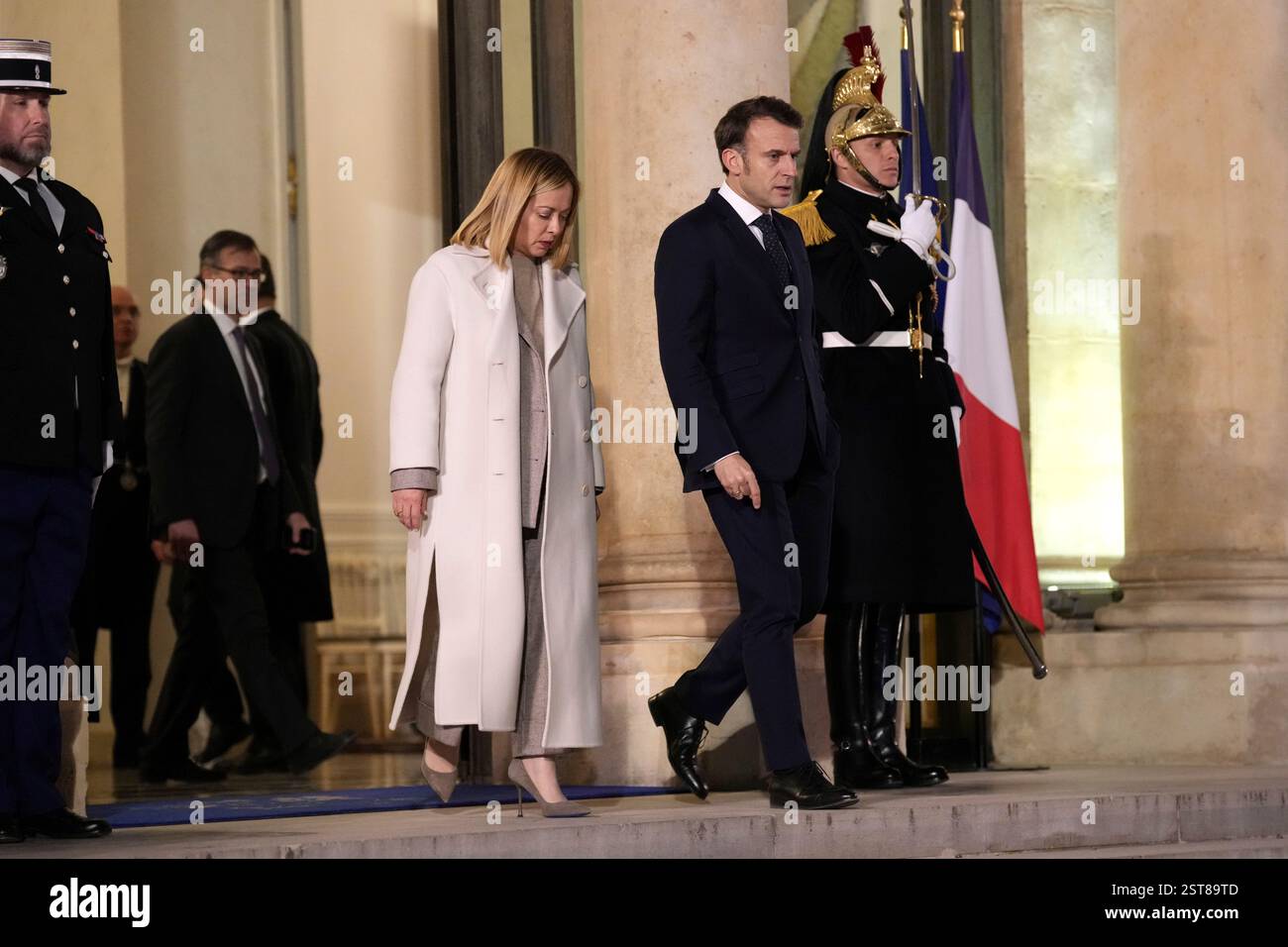 French President Emmanuel Macron, center right, walks with Italy's ...