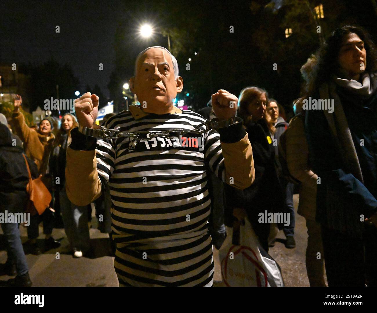 Jerusalem, Israel. 17th Feb, 2025. A man wears a facial mask of Prime ...