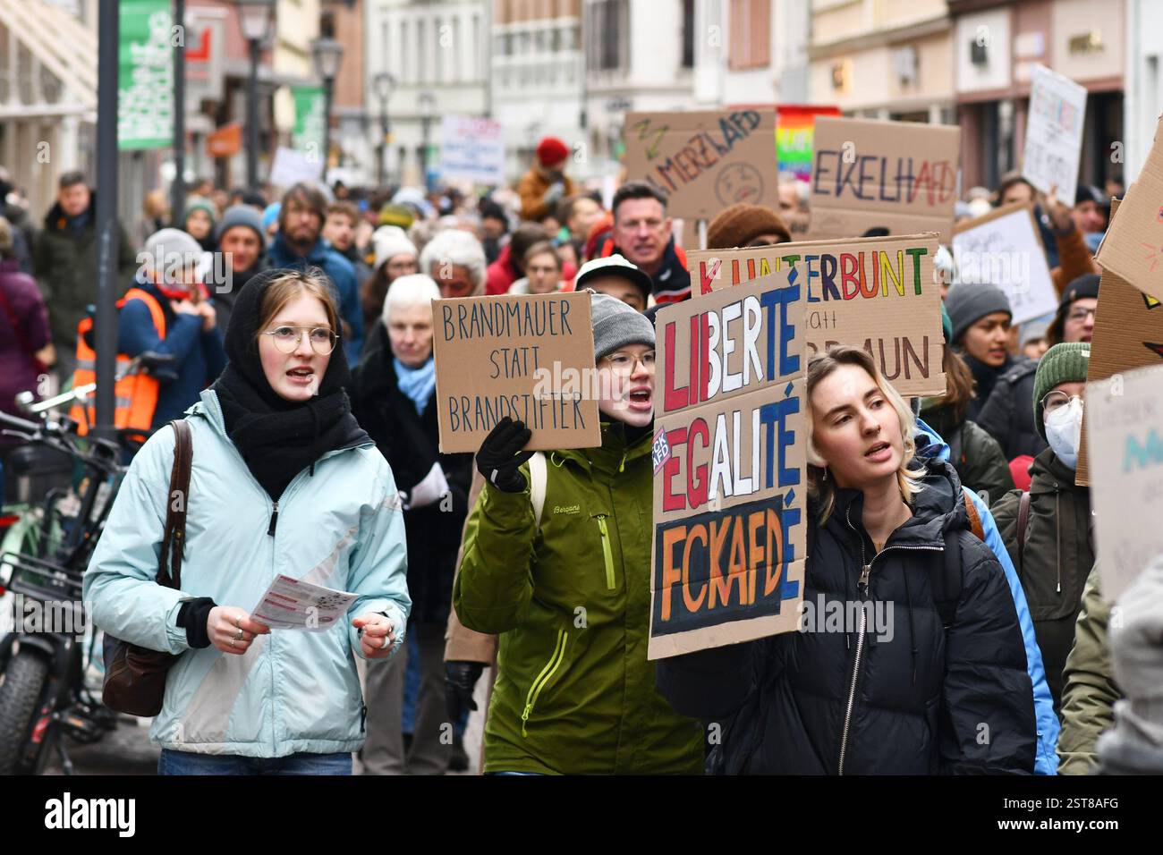 Heidelberg, Germany - February 12th 2025: Young people holding up signs ...