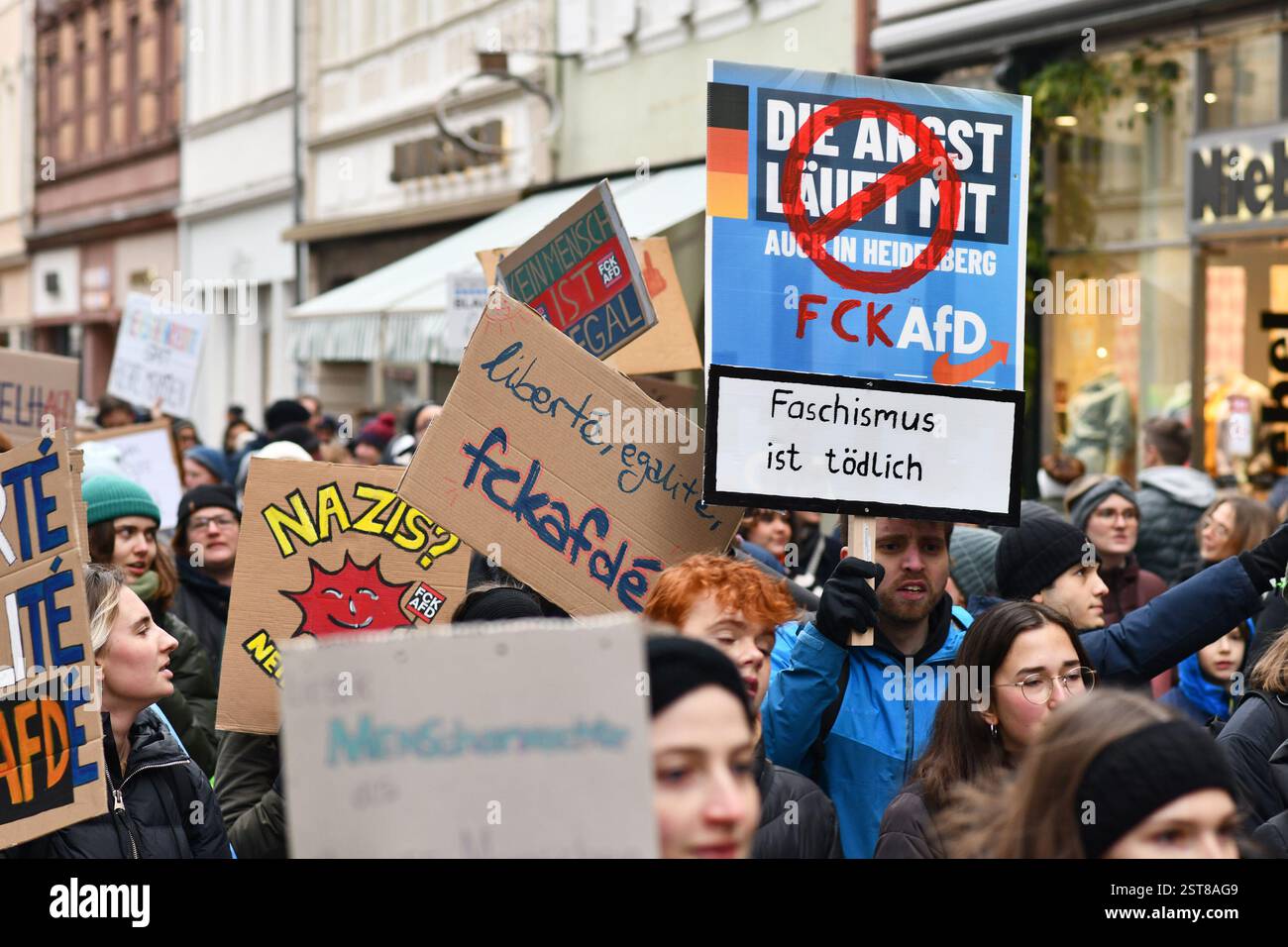 Heidelberg, Germany - February 12th 2025: Young people holding up signs ...