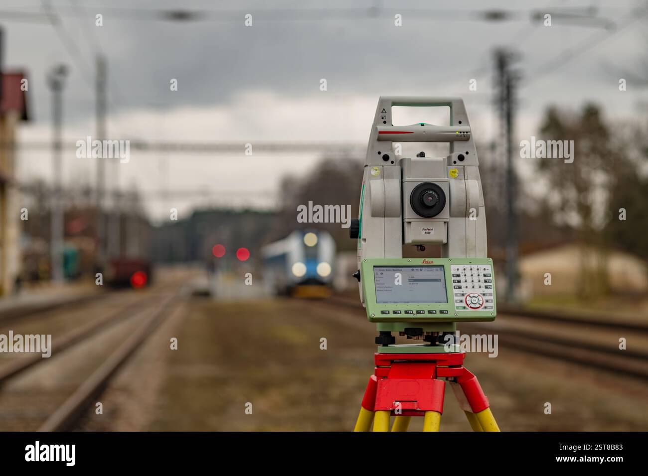 Railway surveyors with electric passenger unit train in station Nove ...