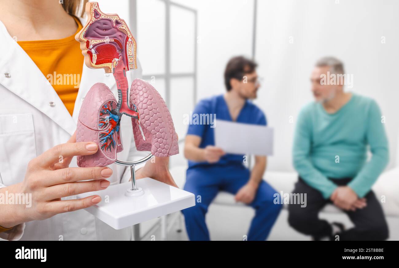 Doctor pulmonologist explains lung health to adult patient with breath ...