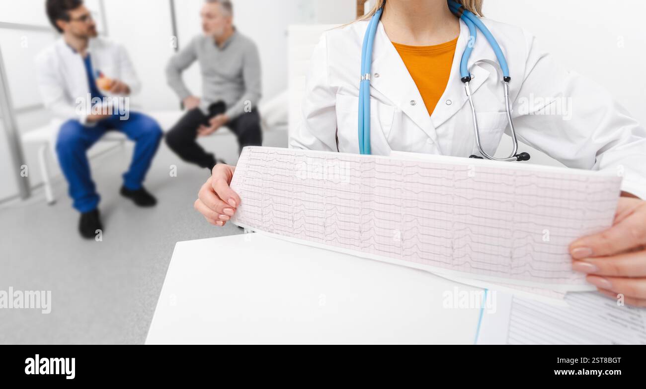 Electrocardiogram test results in doctor hands while cardiology ...