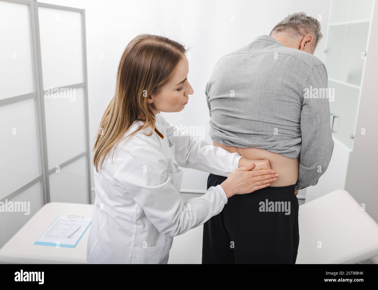 Doctor doing kidney exam for male patient with kidney disease. Urology ...