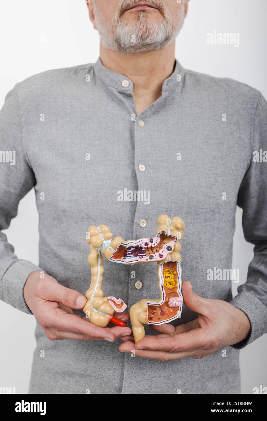 Senior man suffering from constipation and abdominal pain. Treatment of ...