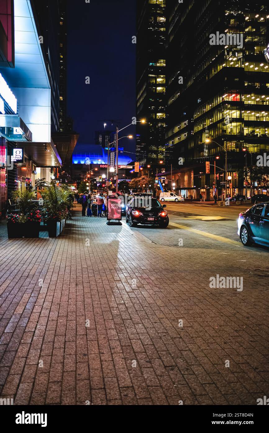 Urban streets of a night city life. Night City Street Building View ...