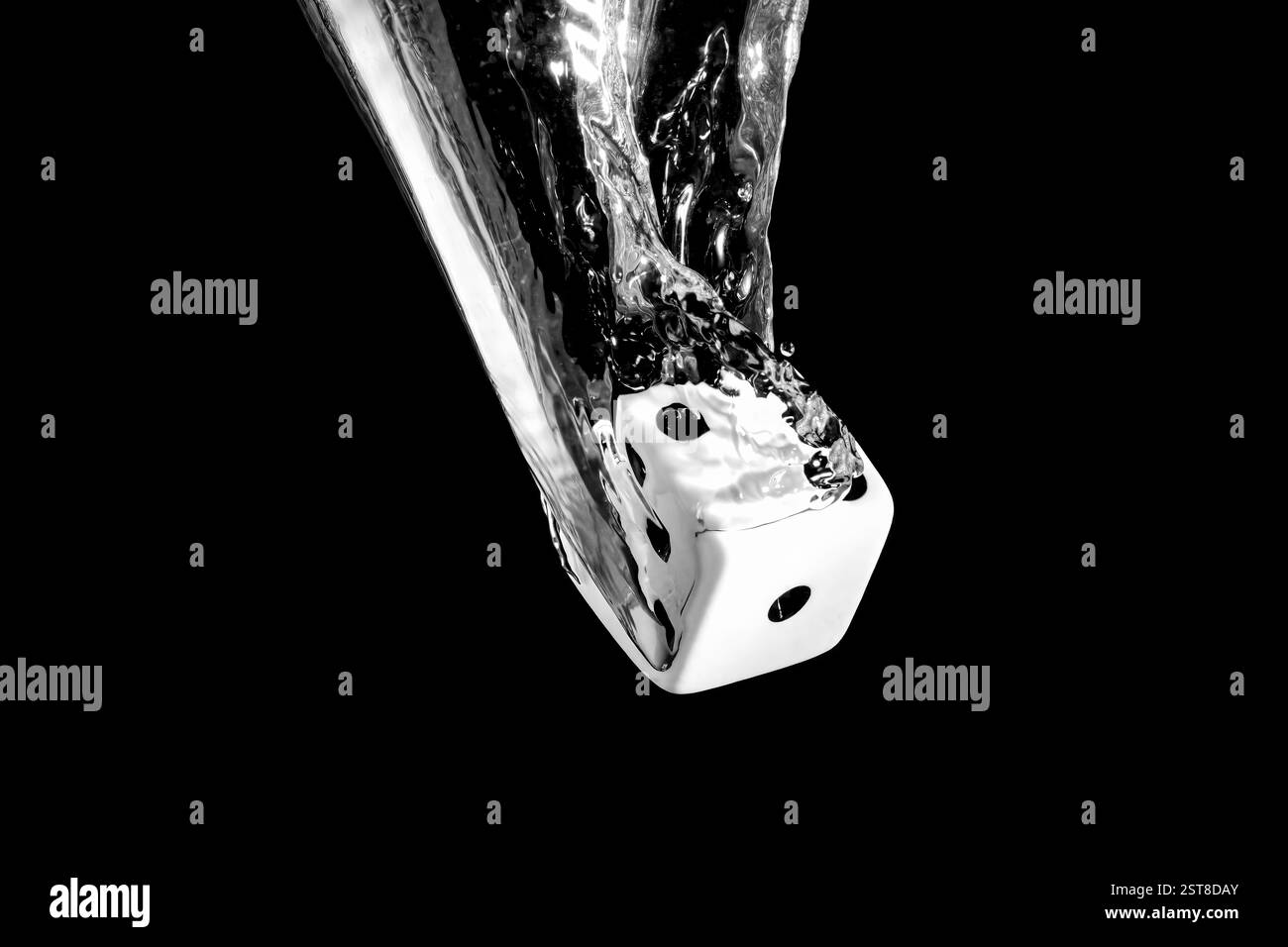 Monochrome photo of a dice as it descent in water with dark background ...