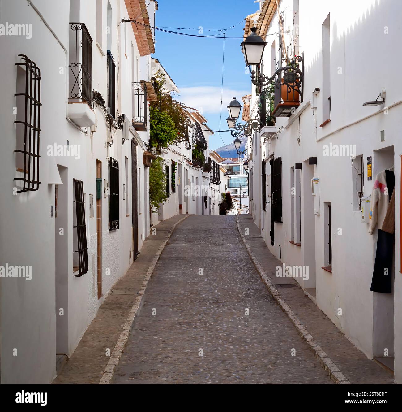 Editorial Altea, Spain - February 01, 2025: One of the quaint narrow ...