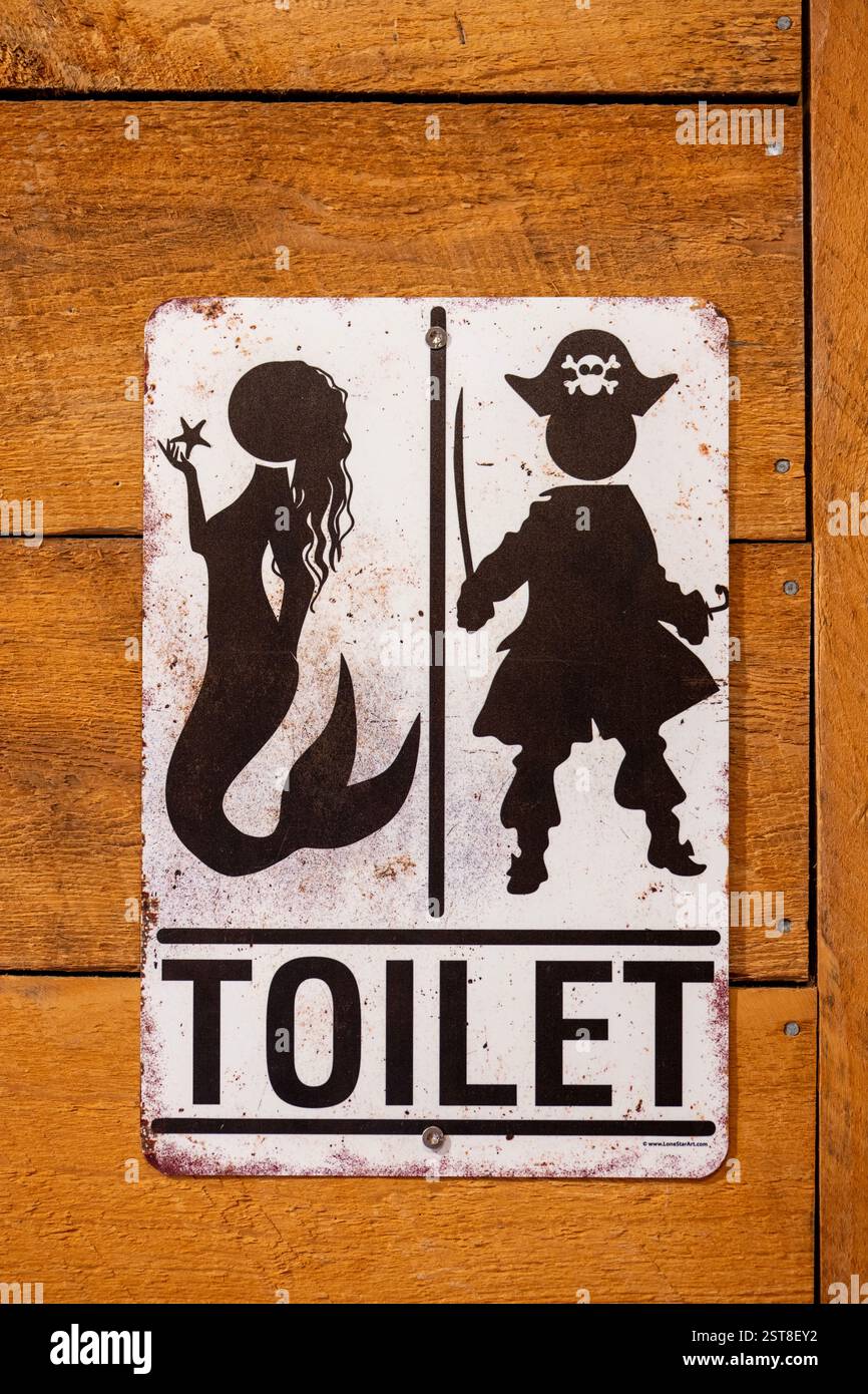 A mermaid and pirate bathroom sign Stock Photo - Alamy