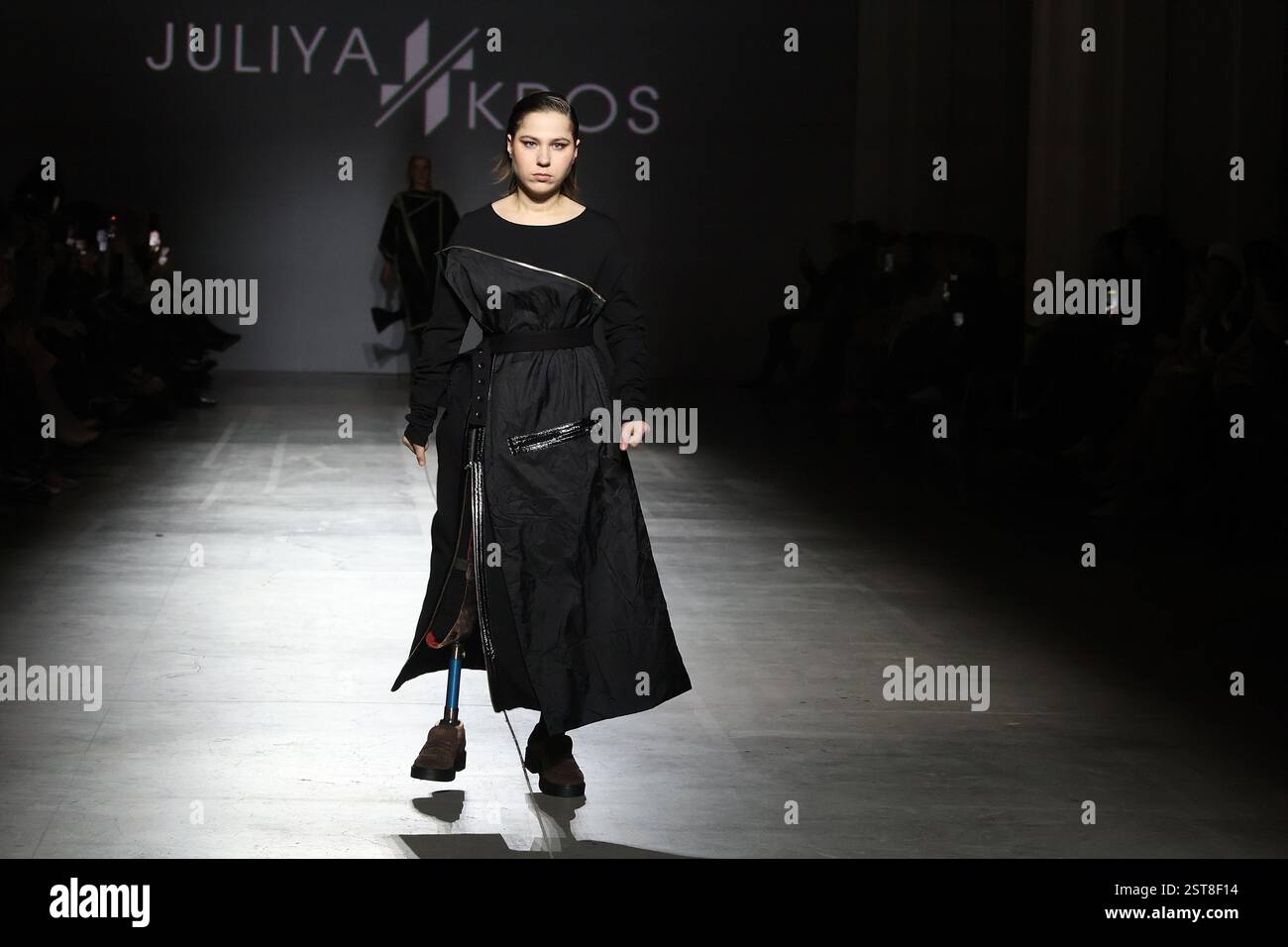 KYIV, UKRAINE - FEBRUARY 15, 2025 - A model with a prosthetic lower limb walks the catwalk ...