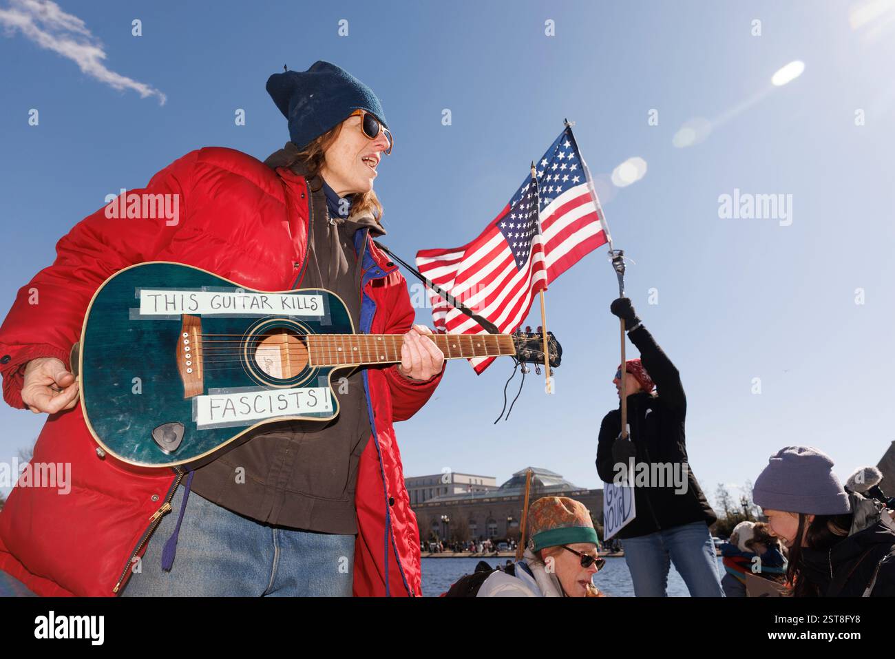 Washington, United States. 17th Feb, 2025. Protesters sing songs as ...