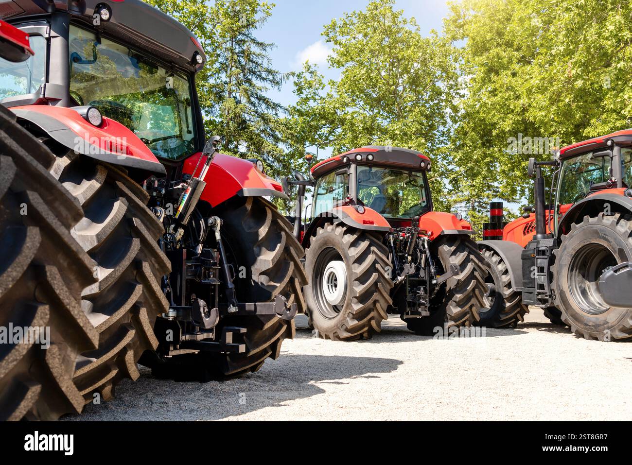 rear view of red farm tractors. agricultural machinery dealership ...