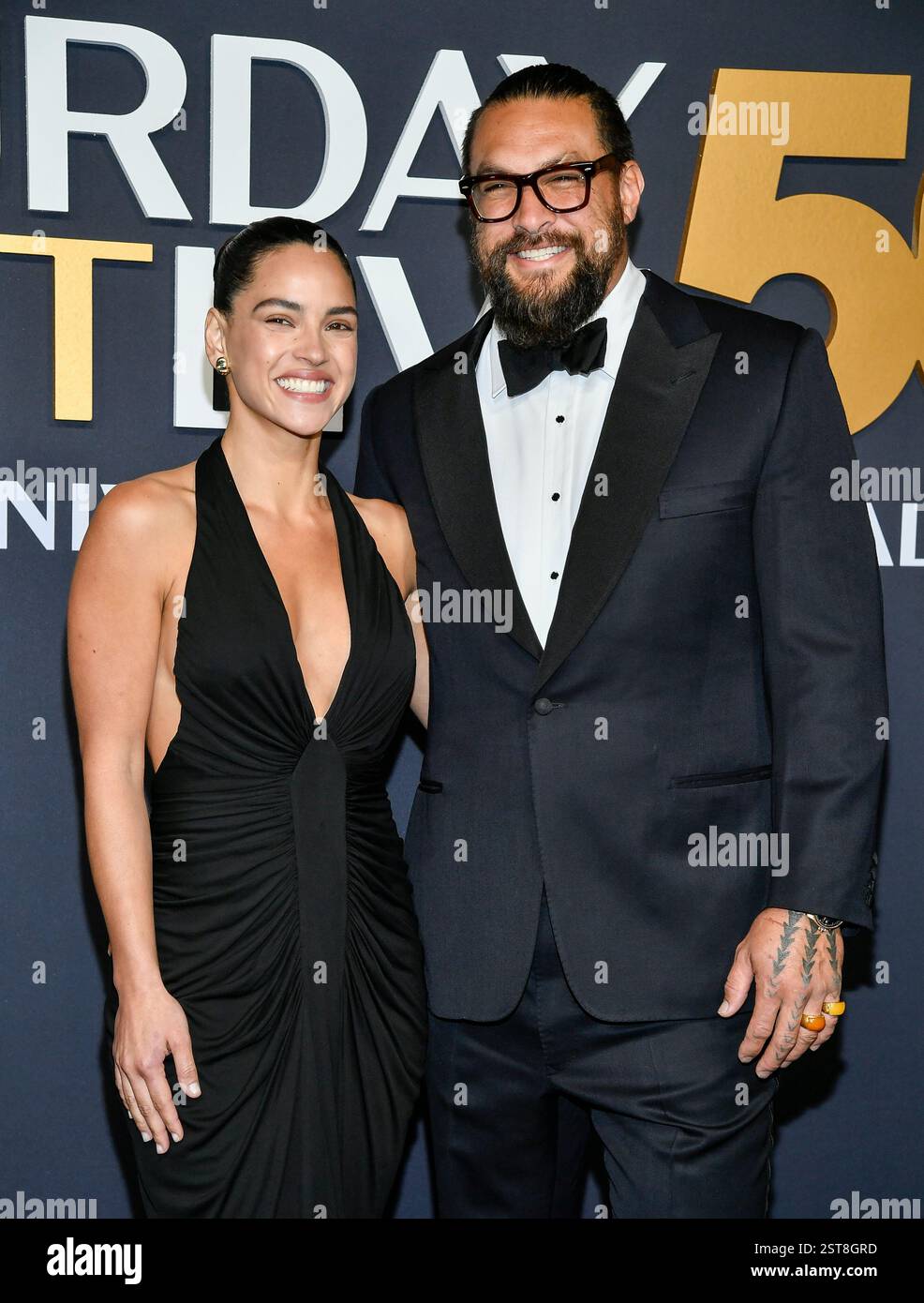 Adria Arjona, left, and Jason Momoa attend the SNL50: The Anniversary ...