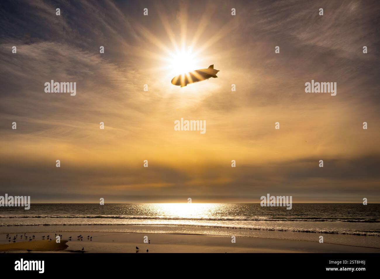 Goodyear Blimp flies over the ocean in Hermosa Beach showing coastline ...