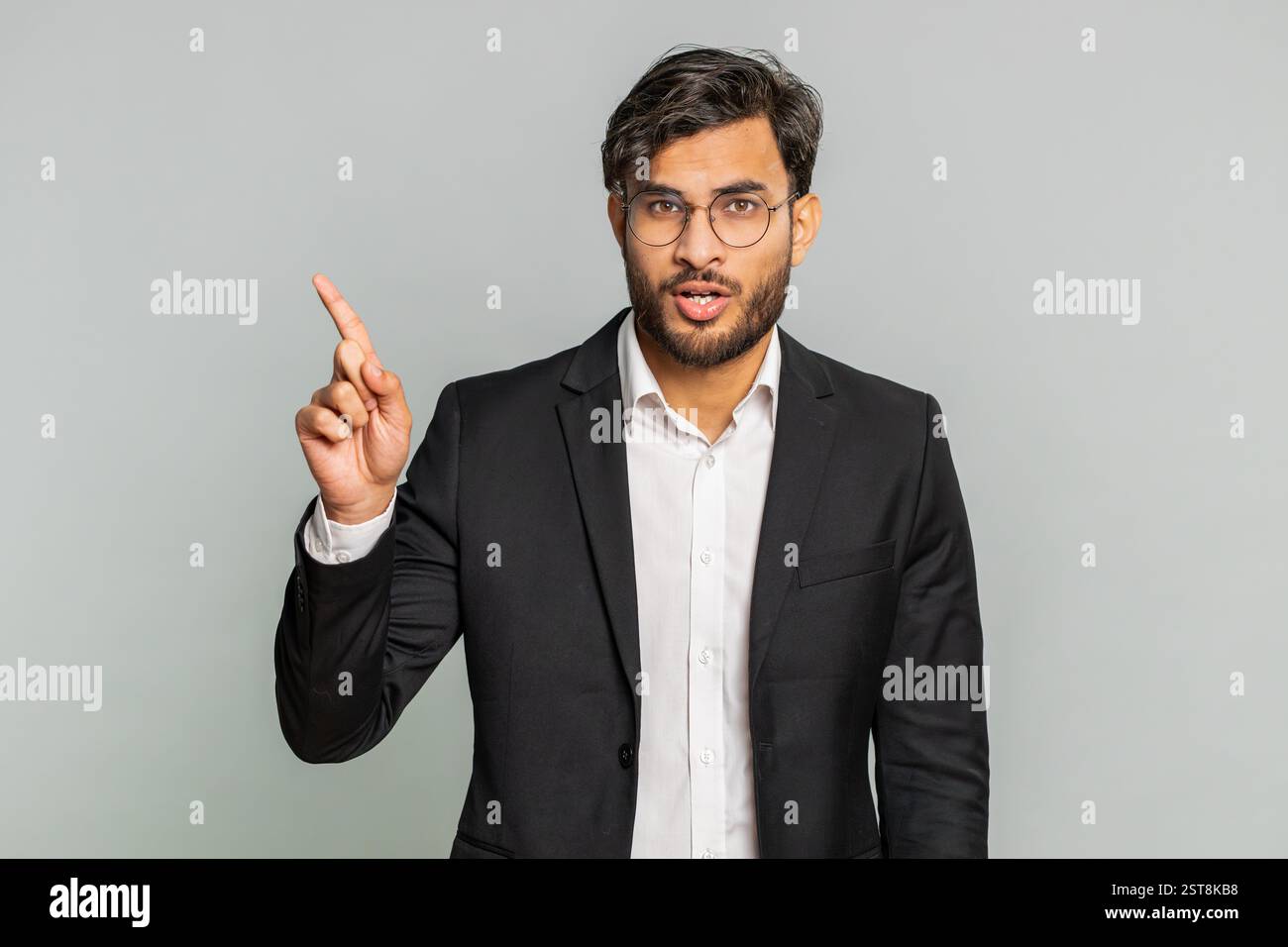 Indian businessman shakes finger and saying no, be careful, scolding ...