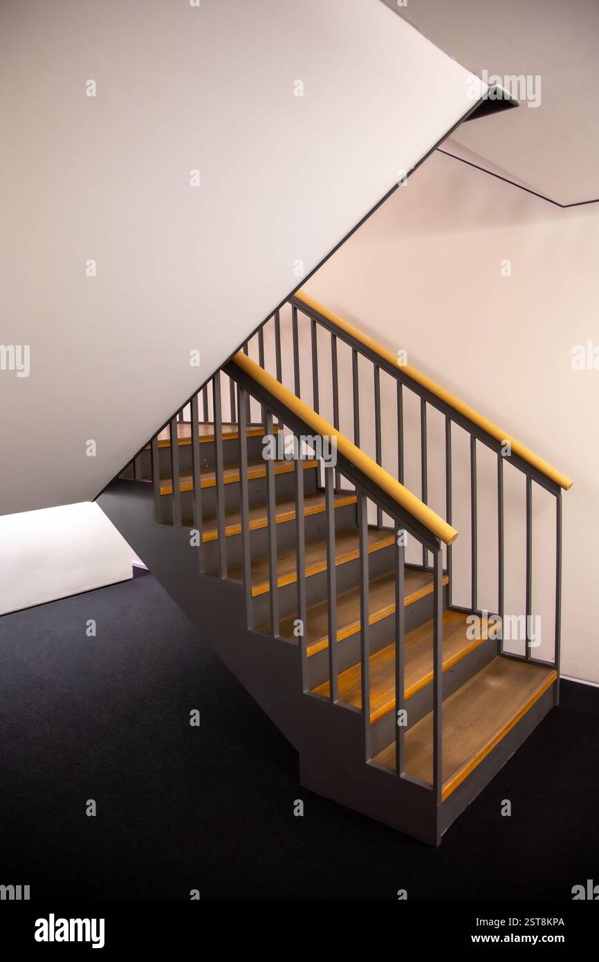 Staircase with wooden steps and handrail in a modern building ...