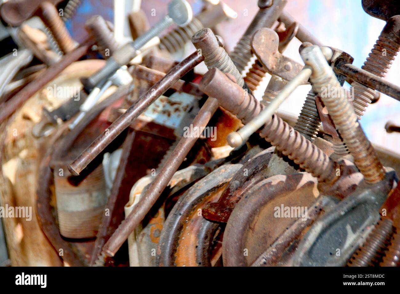 An abstract view of C clamps hanging on a welder's bench Stock Photo ...