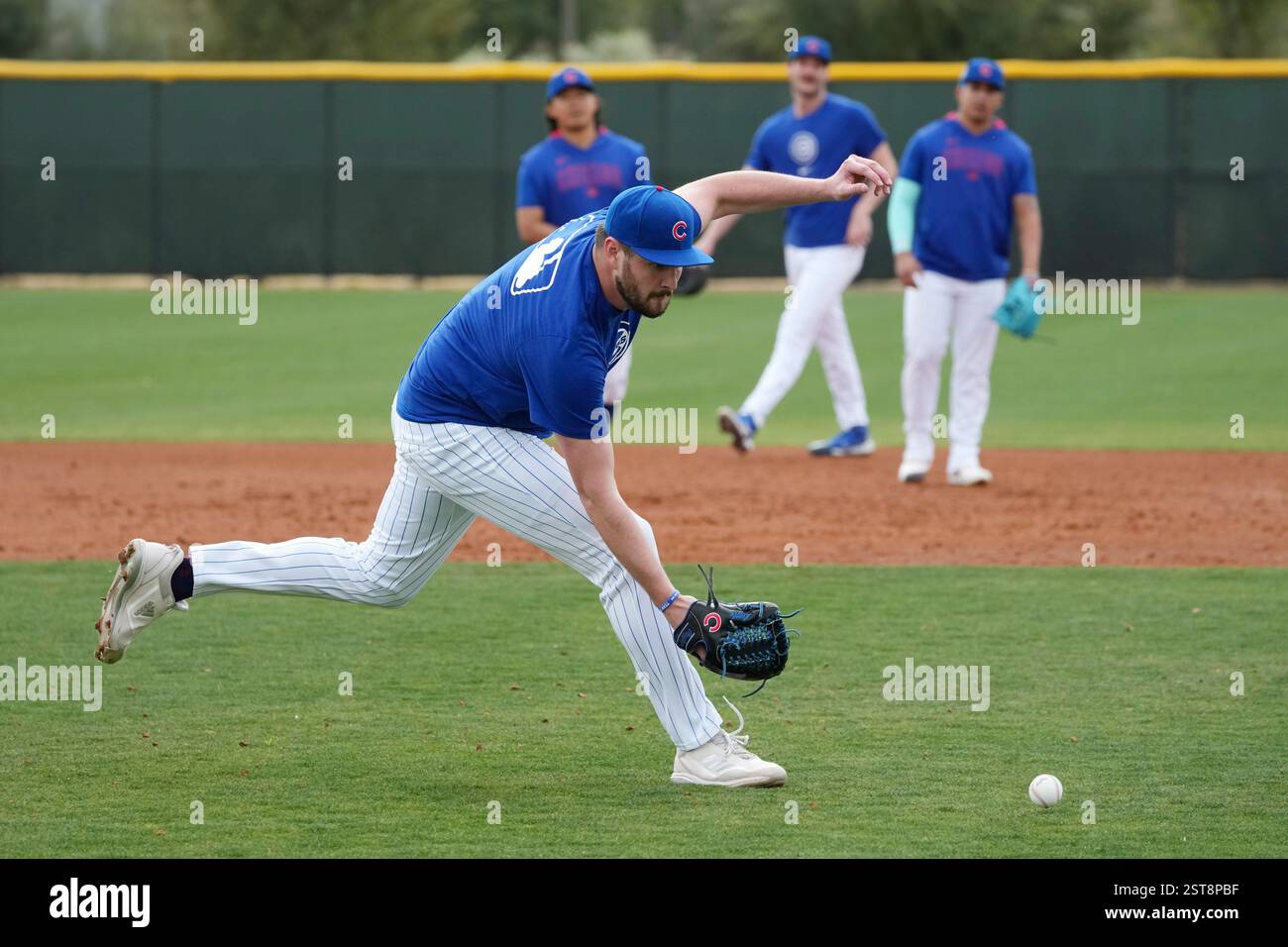 Chicago Cubs pitcher Luke Little fields a grounder at the Cubs baseball ...
