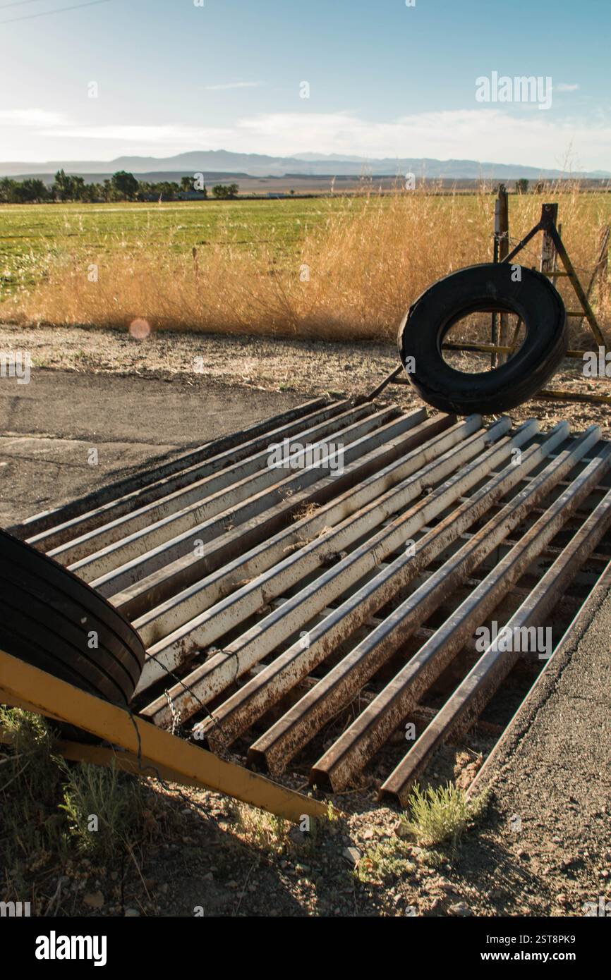 A cattle guard is stretched across a road to prevent cattle from ...