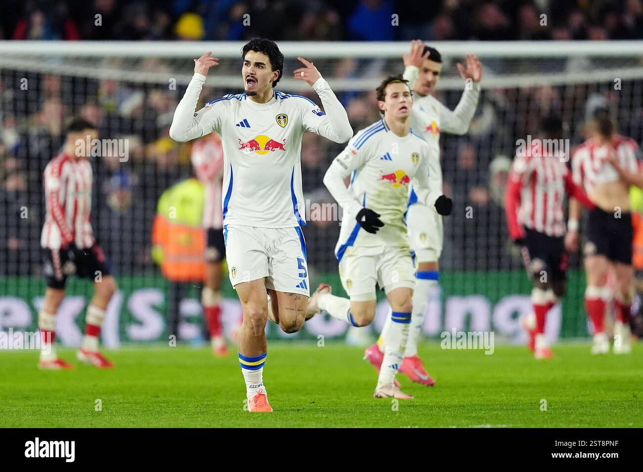 Leeds United's Pascal Struijk (left) celebrates scoring their side's ...