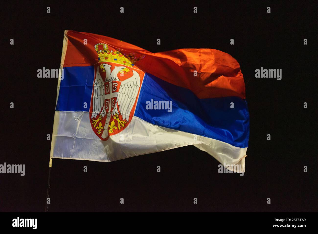 Serbian flag waving in the dark, conceptual composition Stock Photo - Alamy