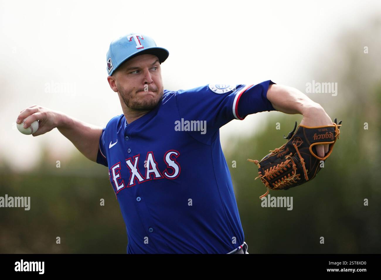 Texas Rangers relief pitcher Jacob Webb warms up during spring training ...