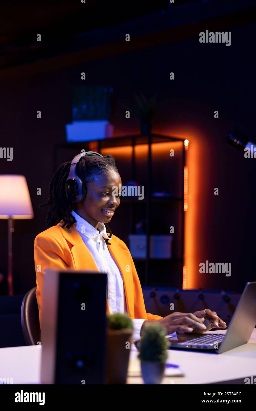 Joyous homeowner using tv hi-res stock photography and images - Alamy