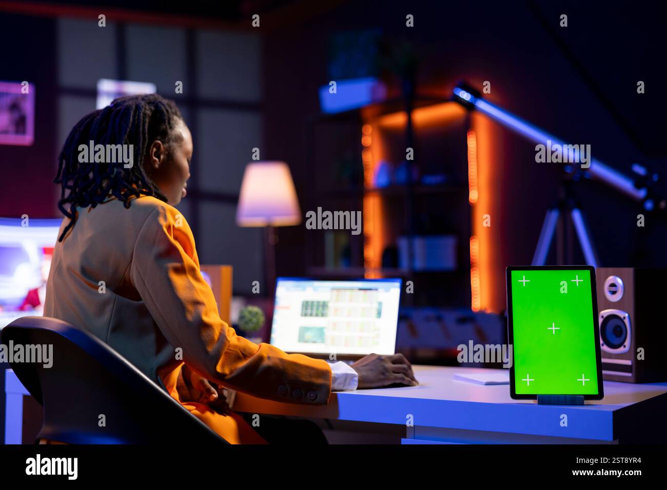 Green screen mockup tablet next to remote employee completing ...