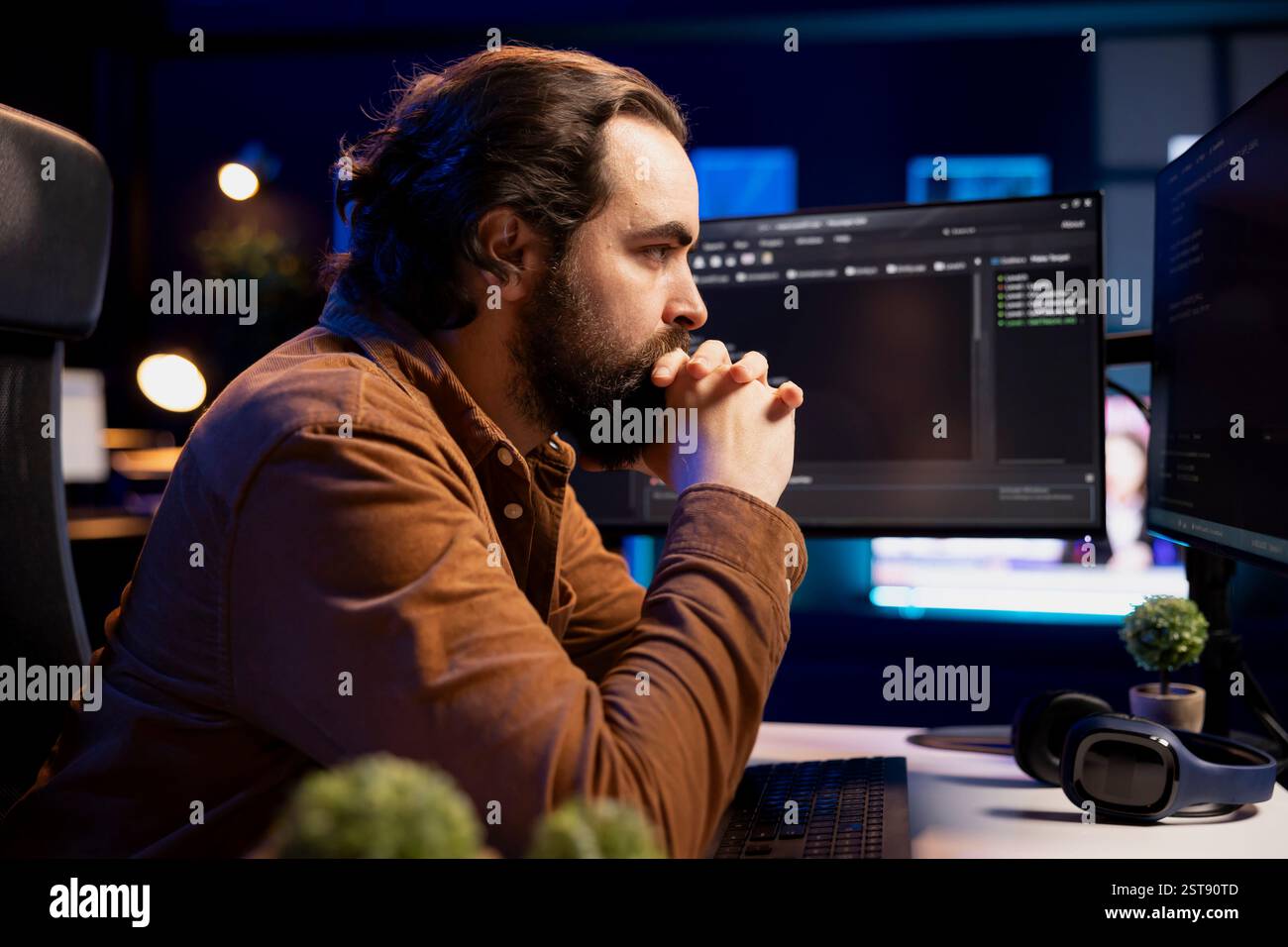 Pensive computer engineer thinking how to futureproof company network from downtimes and ...