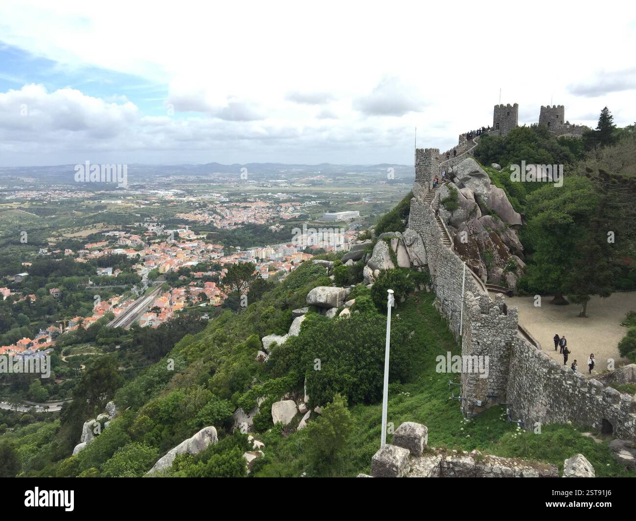 Castle on a hilltop, Sintra, Portugal. Walls made of stone. Lush green ...