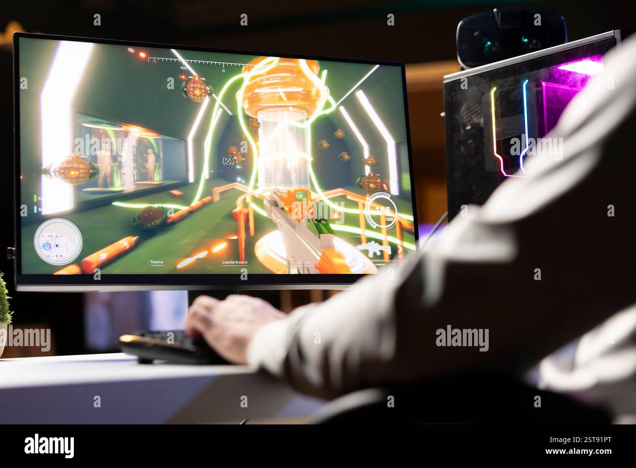 Man enjoying competitive online FPS videogame, battling flying robots ...