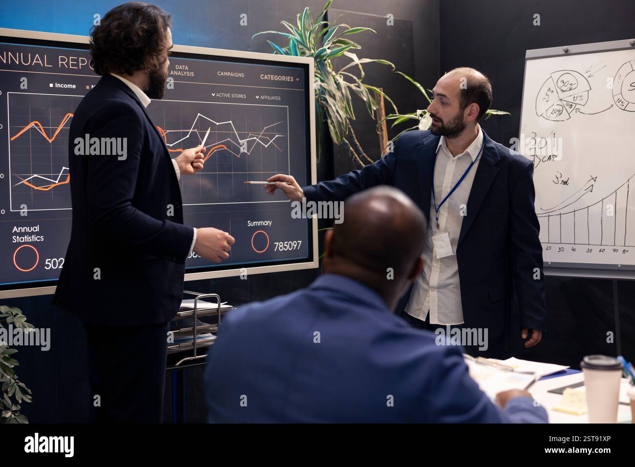 Business partners host a meeting to share insight and ideas about ...