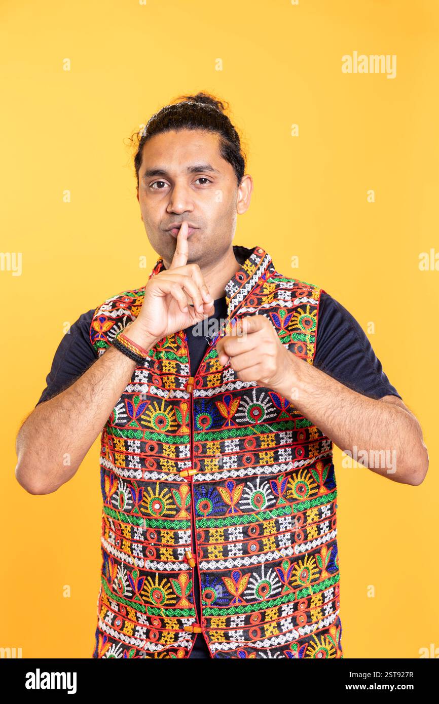 Annoyed man doing shushing hi-res stock photography and images - Alamy
